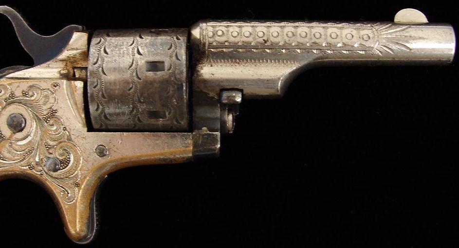 Colt Old Line .22 caliber revolver with silver cylinder. Engraved with ...