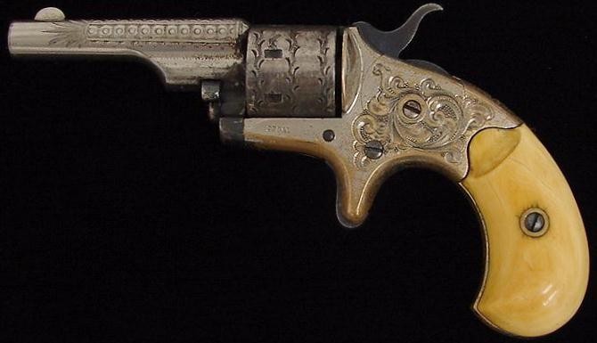 Colt Old Line .22 caliber revolver with silver cylinder. Engraved with ...
