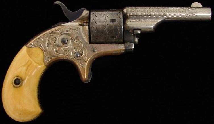 Colt Old Line .22 caliber revolver with silver cylinder. Engraved with ...