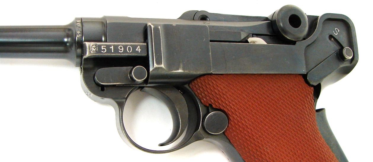 Swiss 1929 .30 Luger caliber pistol. Left side grip has a chip out of ...
