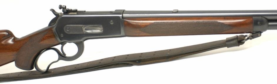 Winchester 71 .348 WCF caliber rifle. Early model 71 deluxe with long tang. 97% original blue ...