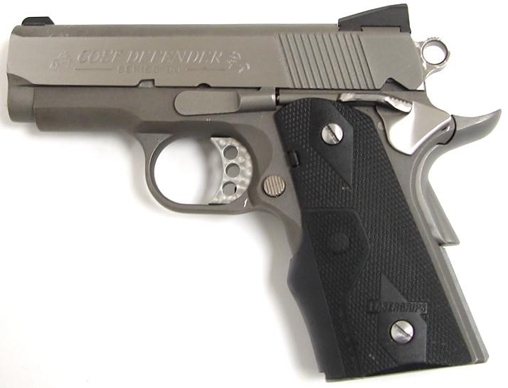 Colt Defender .45 ACP caliber pistol. Customized model with night ...