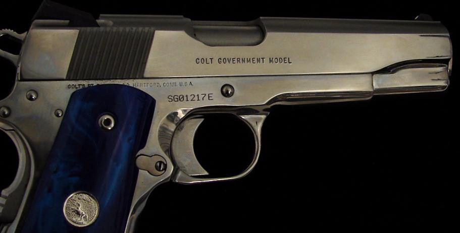 Colt Government .38 Super caliber pistol. Bright stainless steel model ...