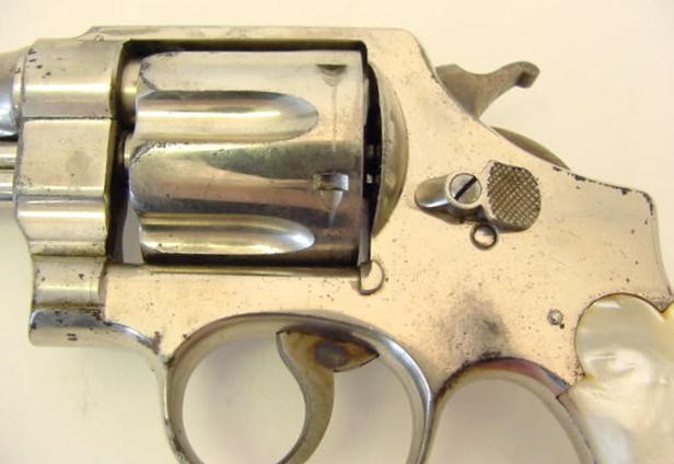 Smith & Wesson Triple Lock 44 Special caliber revolver with carved ...