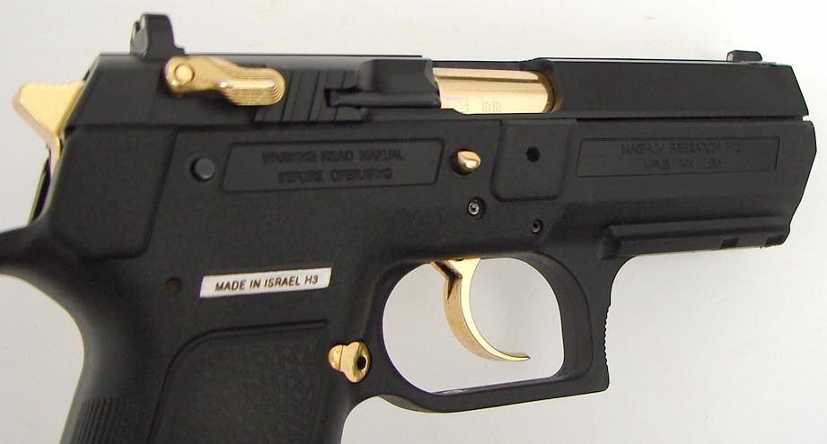 IMI Baby Eagle 9mm caliber pistol. Polymer frame model with custom gold ...