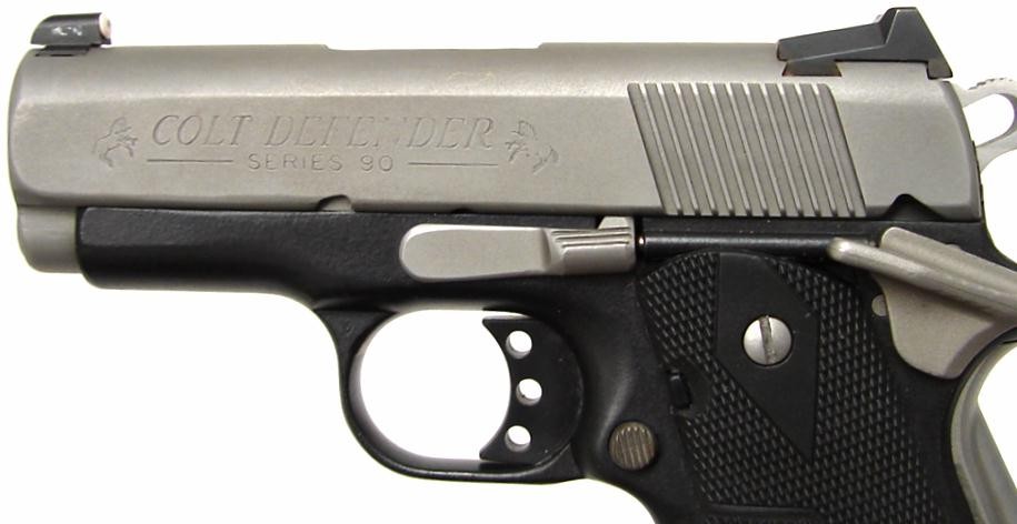 Colt Defender .45 ACP caliber pistol. Customized carry gun with ...
