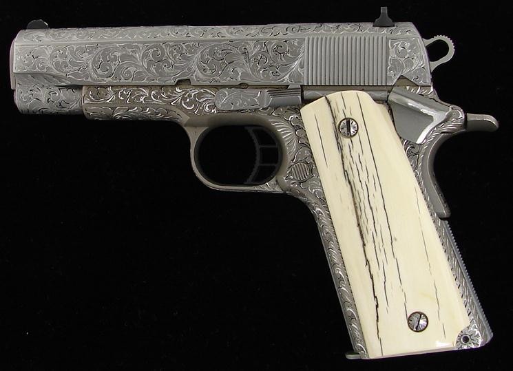 Colt Commander .45 ACP caliber pistol. Stainless lightweight model with ...