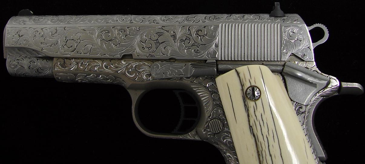 Colt Commander .45 ACP caliber pistol. Stainless lightweight model with ...