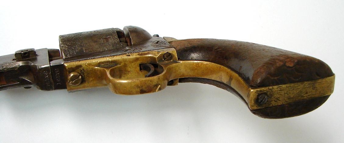 Colt 1851 Navy revolver. Made in 1863. Gun has a brown patina with ...