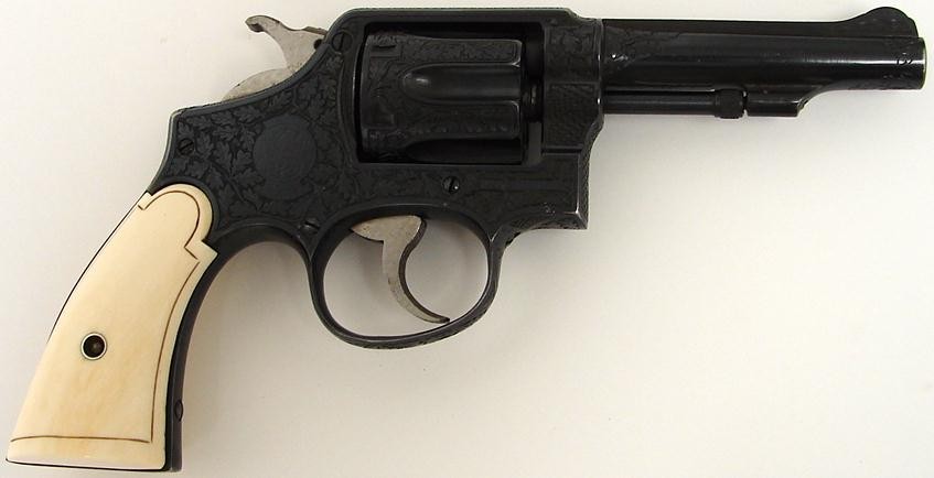 Smith & Wesson M&P .38 Special caliber revolver. Custom engraved with ...