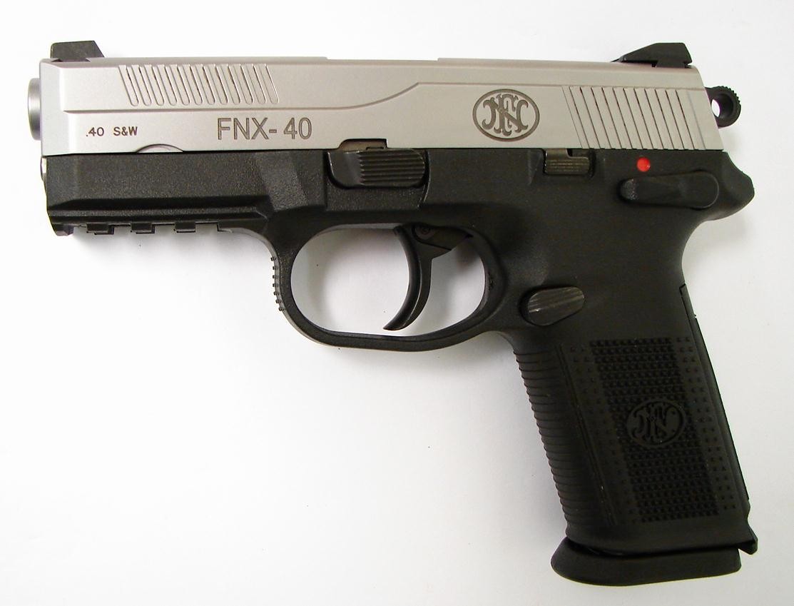 FNH FNX-40 .40 S&W caliber pistol. Stainless model in excellent ...