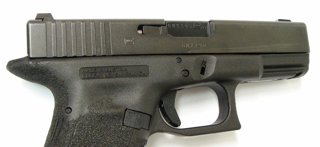 Glock 23 .40 S&W caliber pistol. Compact model with custom grip reshape ...