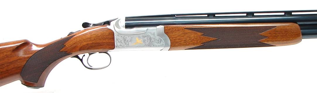 Ruger Red Label 12 gauge shotgun. Engraved model over/under with gold ...