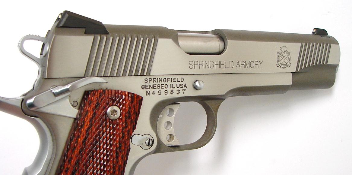Springfield 1911 A1 .45 ACP caliber pistol. Stainless steel "Loaded ...